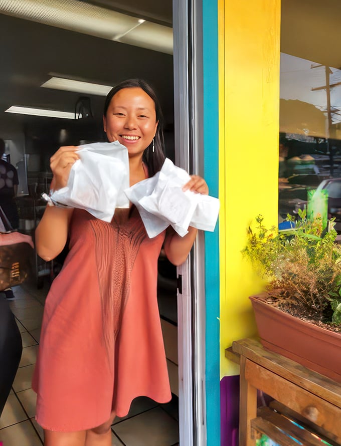 Aloha, happiness! The joy on this customer's face says it all. Whatever's in those bags must be better than winning the lottery.