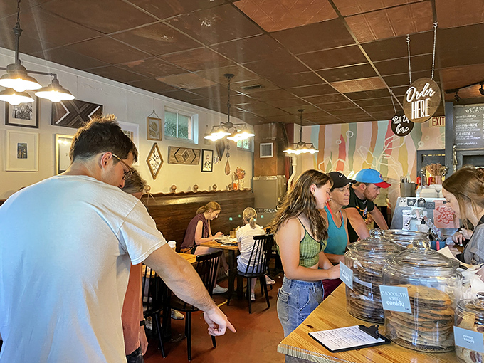 Happy customers, happy life. The bustling interior of Little Bread Company is a testament to its delicious offerings and welcoming atmosphere.