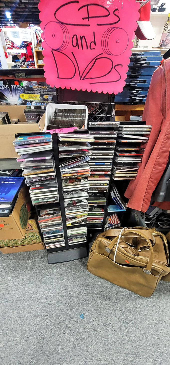 From VHS to DVD, this media cornucopia is a blockbuster of memories. Movie night, anyone? Popcorn not included, but nostalgia definitely is.