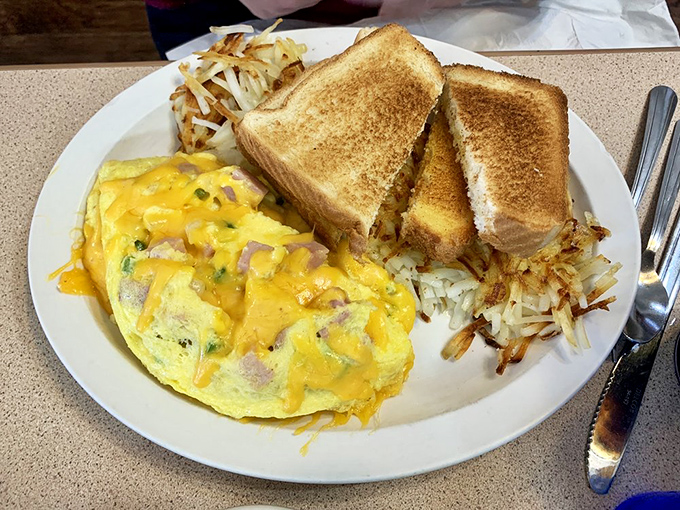 The Denver omelet that puts the 'mile high' in Mile High City! Fluffy eggs meet crispy potatoes in a match made in breakfast heaven.