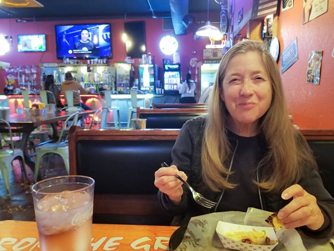 Happy faces and full plates! This diner's smile says it all &ndash; JD's is where food meets joy, and calories don't count.
