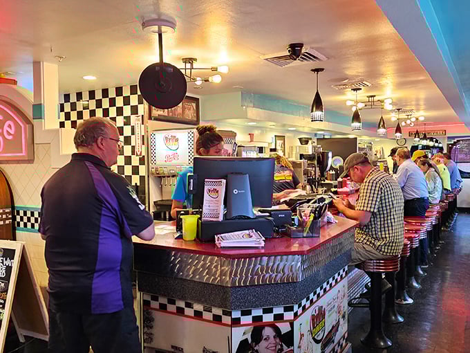 Pull up a stool and join the club! This bustling counter scene is like a Norman Rockwell painting come to life &ndash; with better coffee.