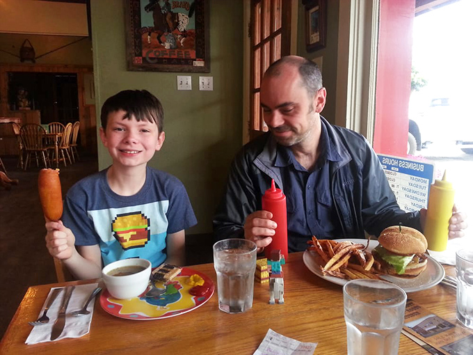 The universal language of good food bringing smiles to faces young and old&mdash;ketchup bottles standing by as willing translators.