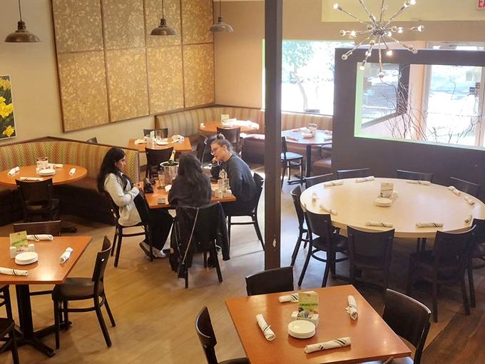 Tables positioned for both privacy and people-watching—the hallmark of restaurants that understand the dual purpose of dining out.