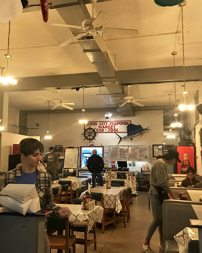Ahoy, fellow food lovers! This dining area is buzzing with the energy of happy eaters embarking on their culinary journeys.