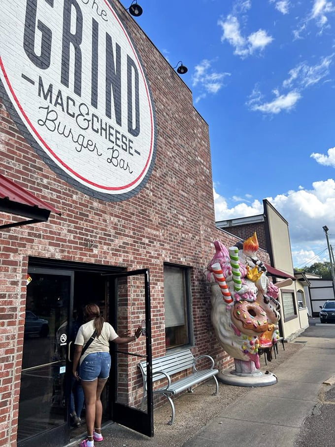 The entrance to cheese paradise, complete with a whimsical candy-themed sculpture that hints at the sweet excess waiting inside.