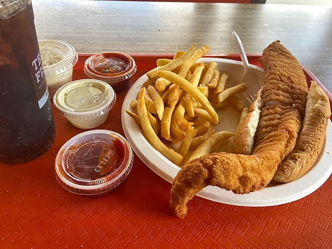 The Leaning Tower of Yum! This fish sandwich is stacked higher than a Jenga tower at a tremor convention.