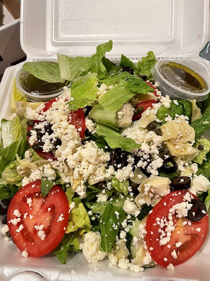 Who says you can't be healthy at a pizzeria? This Greek salad is a fresh, crisp counterpoint to all that delicious, cheesy goodness.
