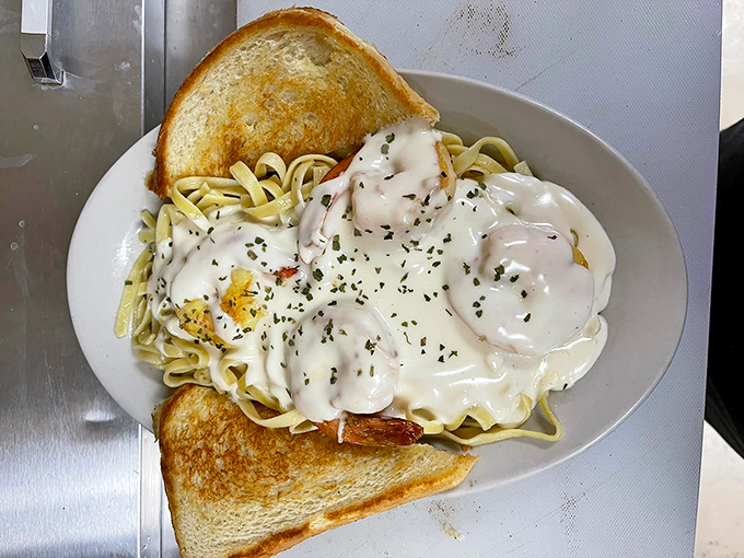 Grilled Shrimp Alfredo: Where land meets sea in a creamy pasta paradise. It's like a beach vacation for your taste buds.