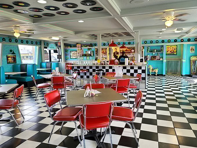 Retro chic meets cozy comfort. With its turquoise walls and red vinyl booths, this diner interior is like a warm embrace from the past.