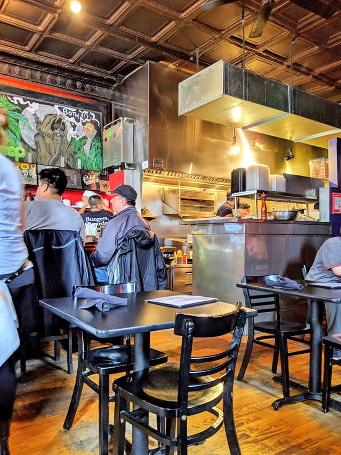 Where burger magic happens! Kuma's open kitchen lets you peek behind the curtain of their culinary concert.