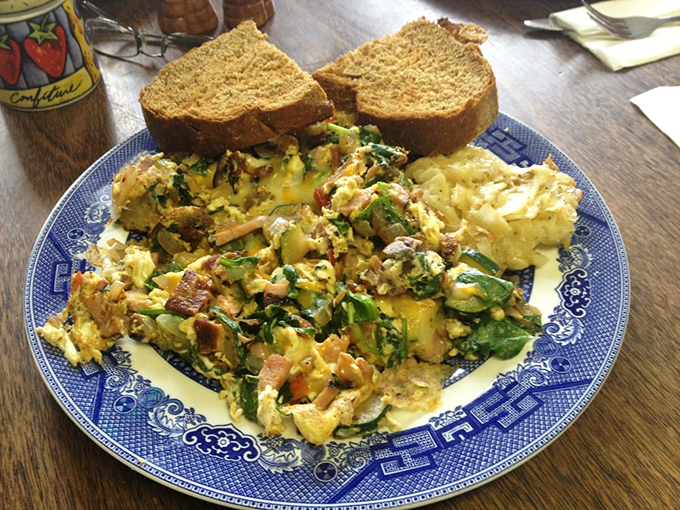 Eggs-cellent choice! This colorful scramble is like a garden party on your plate.