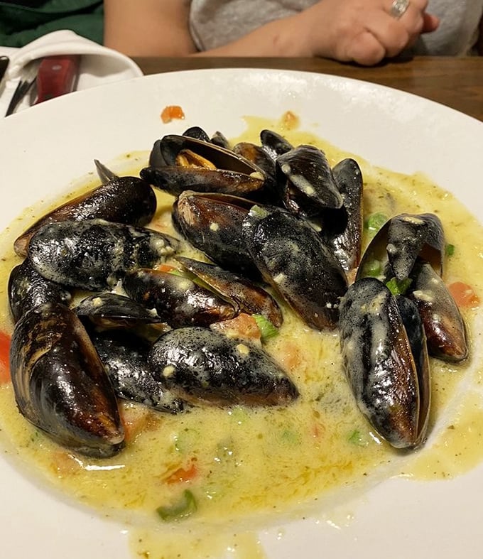 These mussels aren't just flexing - they're swimming in a sauce so good, you'll want to dive right in. Don't forget the bread for dipping!