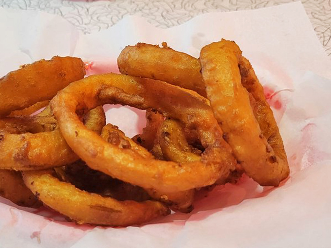 Crispy, golden rings of joy. These onion rings are like edible halos, sent from the fryer to bless your taste buds.