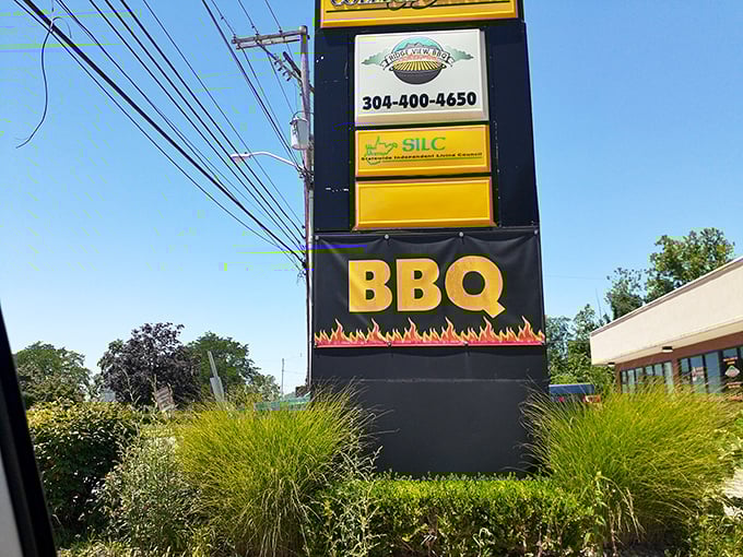 Follow the flames to flavor paradise. This sign isn't just giving directions; it's issuing a challenge to your taste buds.