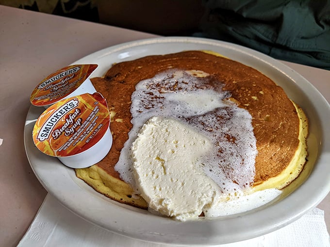 This pancake is so big, it needs its own area code. Fluffy, golden, and ready to make all your breakfast dreams come true.