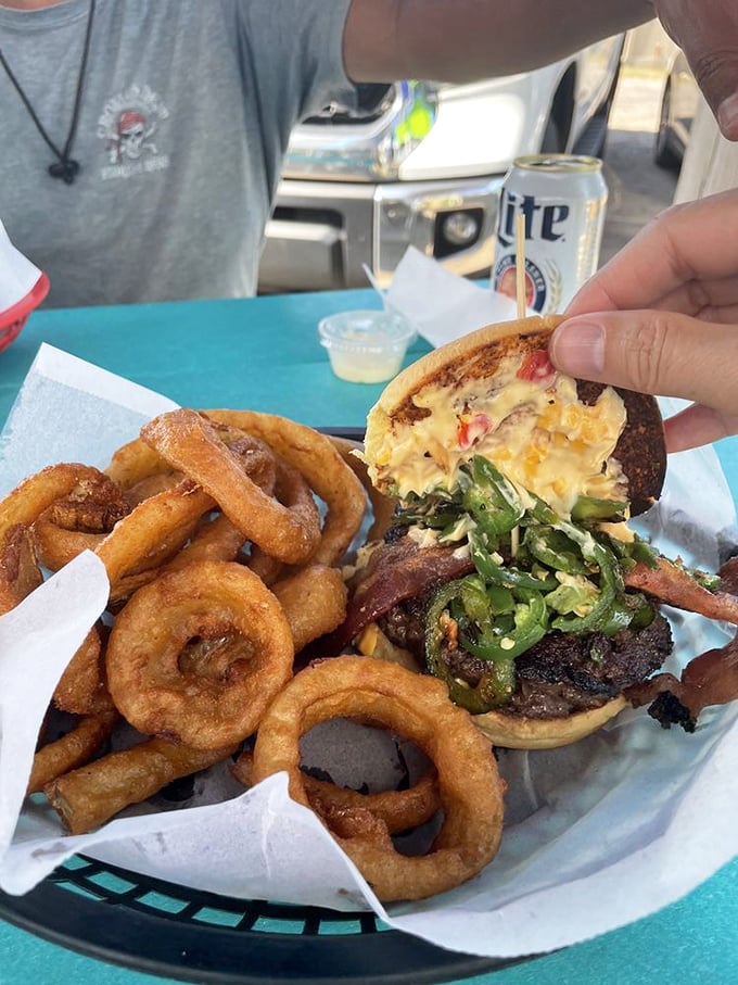 This pimento burger's got more layers than your favorite soap opera. And those onion rings? Crunchier than walking on fall leaves.