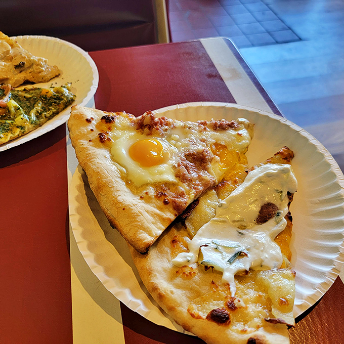 Eggcellent choice! This sunny-side-up slice proves that breakfast pizza isn't just for mornings &ndash; it's an anytime indulgence.