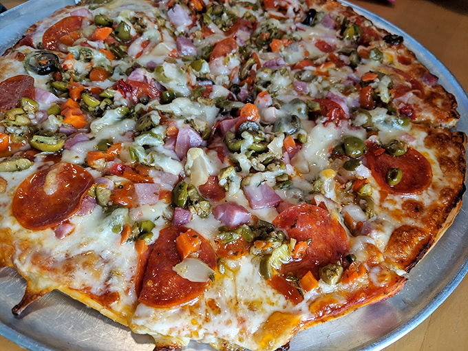 Who ordered a pizza at a burger joint? Someone's zigging while everyone else zags, and it looks deliciously rebellious.