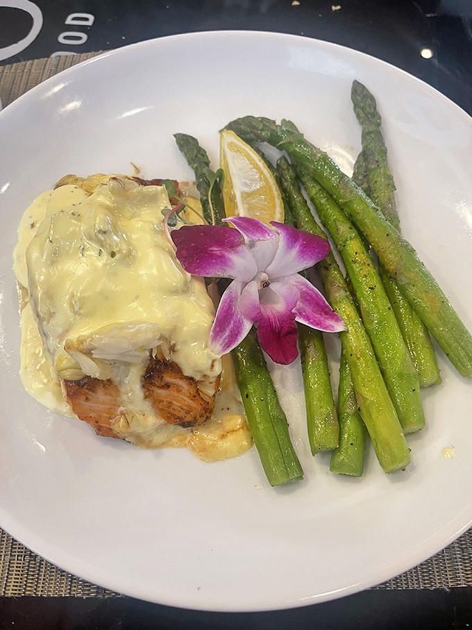 This salmon dish is so pretty, it could be in a seafood beauty pageant. The asparagus spears are like a green carpet for the fish superstar.