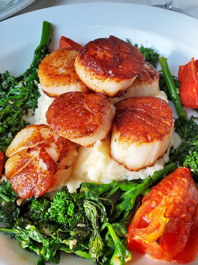 Scallops so perfectly seared, they could make a mermaid trade in her tail! Nestled on a bed of greens, these beauties are ocean-to-plate perfection.