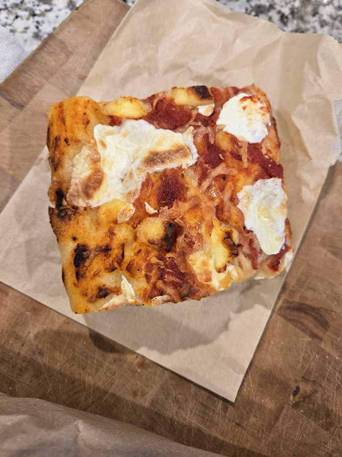 Pizza's hip cousin, the 'sheetza'! This rectangular rebel is loaded with cheesy, saucy goodness. Square meal? You bet!