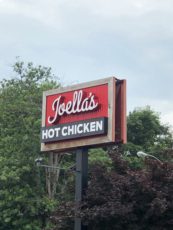 Follow the sign to satisfaction. This roadside beacon guides hungry travelers to their crispy, spicy destiny.