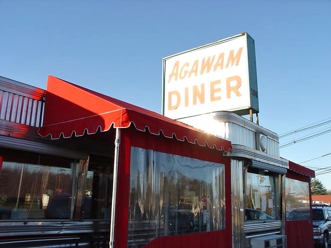 The bat signal for hungry souls! This sign is like a lighthouse, guiding weary travelers to a safe harbor of hearty meals and homemade pies.