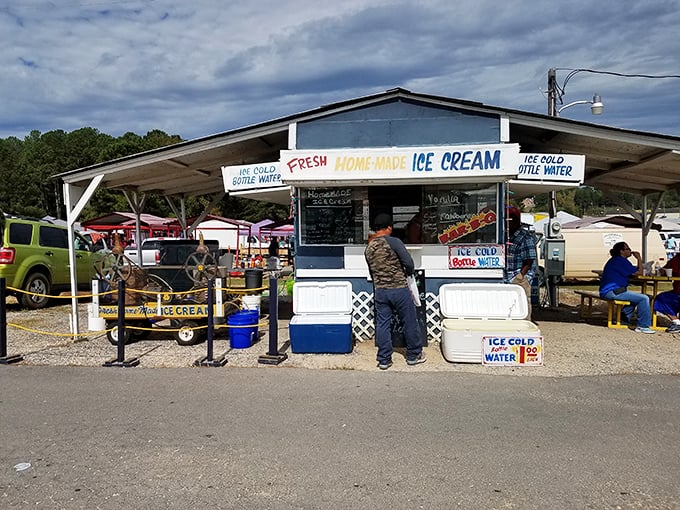 Beat the heat with a sweet treat! This ice cream stand is an oasis of cool in the bustling market. Nothing says "successful shopping trip" like a cone of homemade goodness.