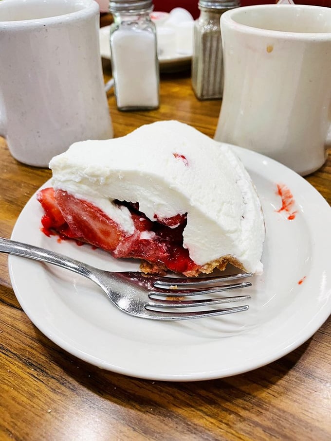 The legendary strawberry pie that put Strawn's on the map. That mountain of whipped cream isn't compensating for anything &ndash; the pie beneath is the real star.
