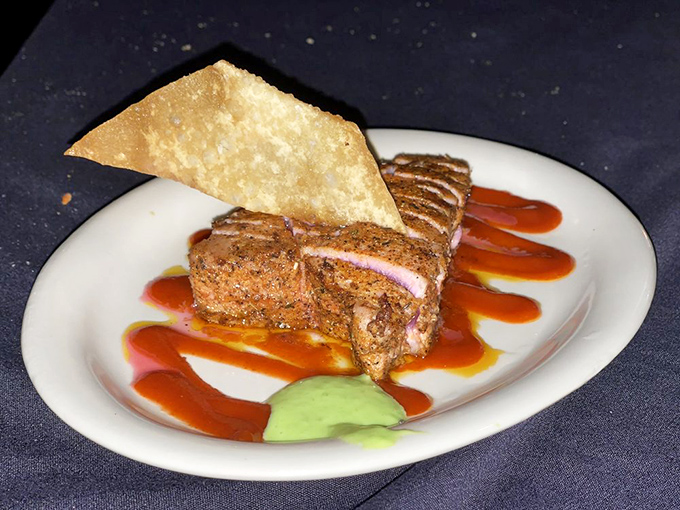 The Tuna Napoleon: Where fish meets art. It's stacked higher than your grandpa's stories and twice as colorful. A feast for the eyes and the taste buds!