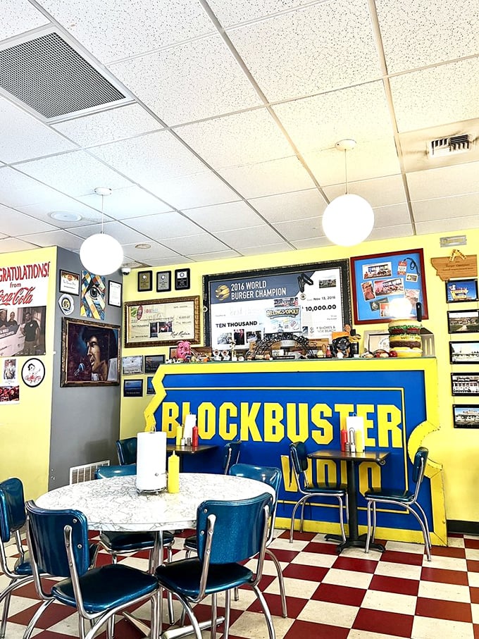 Wall of fame or wall of yum? The Burger Dive's accolades are as stacked as their burgers. Blockbuster memories included at no extra charge!