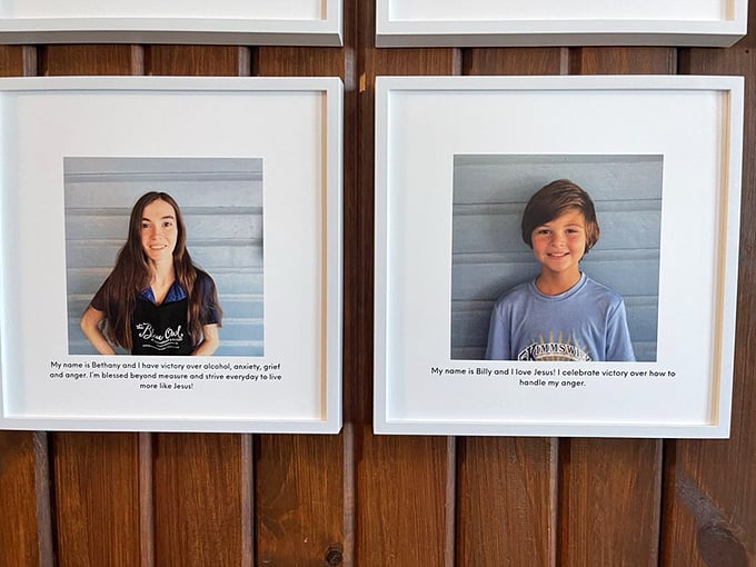 Wall portraits sharing stories of resilience. The Blue Owl isn't just serving food; it's serving heart and community.