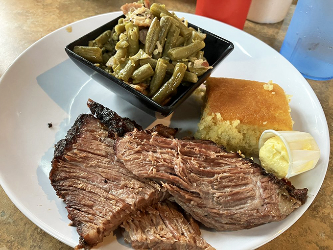 Brisket so tender, it practically melts on the plate. Paired with those sides, it's a symphony of Southern comfort.