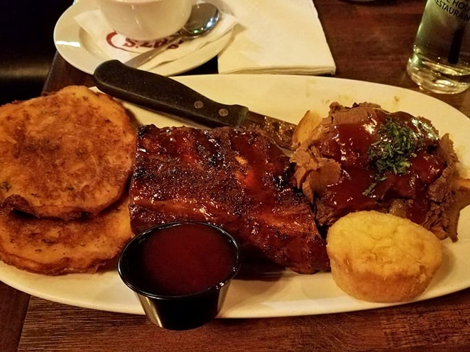 A plate that answers the eternal question: "Why choose between ribs and brisket when you can have both?" The cornbread is just a bonus.