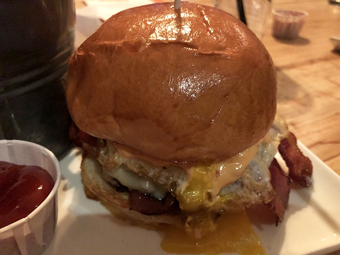 Is this burger smiling at me? With its glistening bun and melty cheese cascade, this beauty is ready for its close-up &ndash; and your first bite!