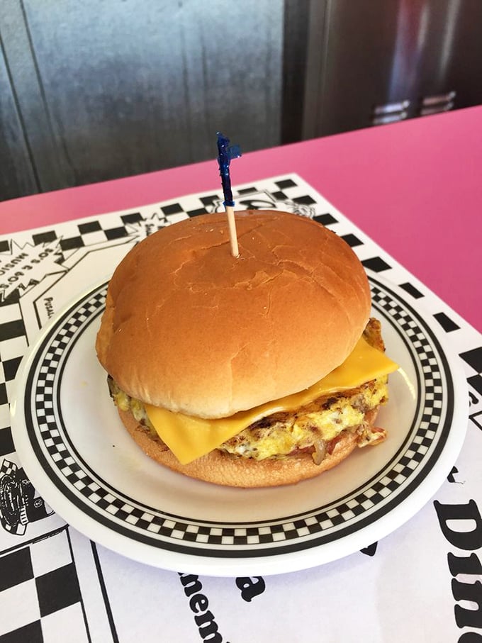 Cheese Louise! This burger is a work of art, with its perfectly melted American cheese and a bun so golden it could win a beauty pageant.
