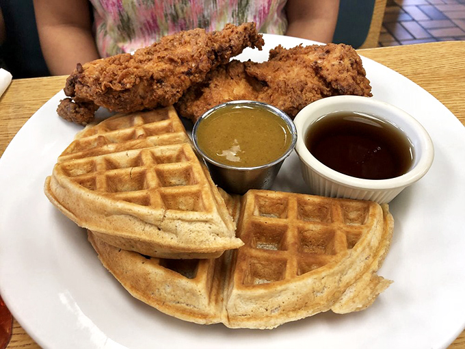 Chicken so crispy, it could make a grown man weep. Paired with waffles so fluffy, they're practically levitating off the plate.