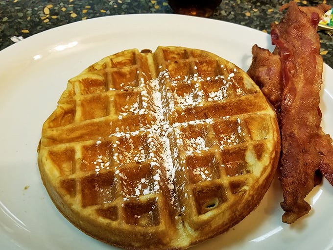 Waffle perfection: golden, crisp, and ready for its syrupy close-up. Add bacon, and you've got a breakfast worthy of the gods.