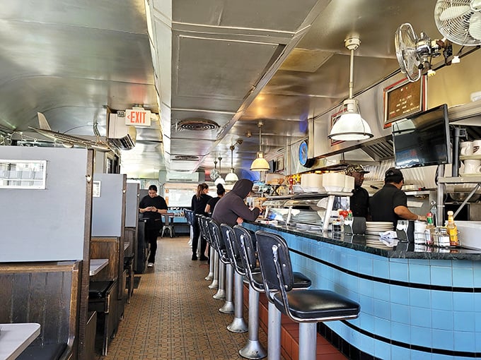 The counter&mdash;where solo diners find community, regulars find their usual spots, and everyone finds excellent service.