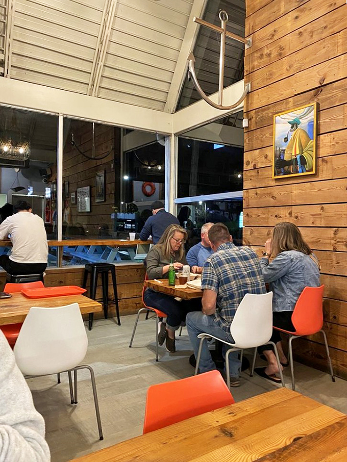 Happy diners lost in seafood bliss. This isn't just eating, it's a full-on maritime adventure for your taste buds.