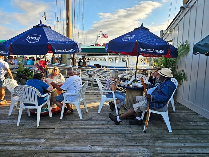 Happy diners soaking up sun and suds. It's like a Jimmy Buffett song, but with better food and fewer parrots.