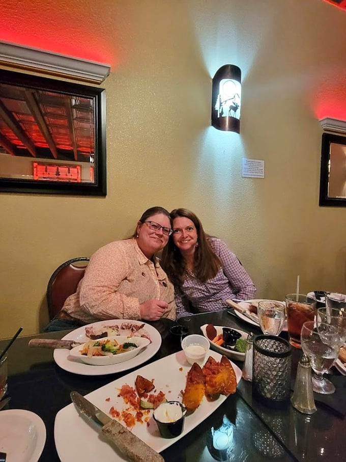 Happy diners caught in their natural habitat. Notice the telltale signs of food bliss: empty plates and wide smiles.