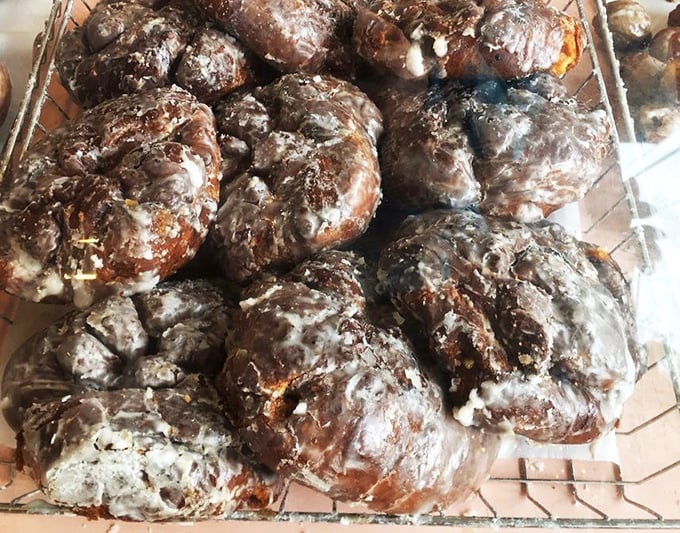 If these apple fritters could talk, they'd say "resistance is futile." Their glistening, craggly exteriors hide pockets of apple-cinnamon paradise within.
