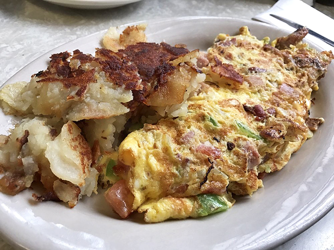 The "everything but the kitchen sink" omelet! This eggy behemoth is so packed with goodies, it might need its own zip code.