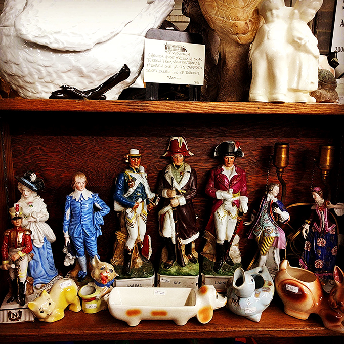 It's a small world after all! These quirky figurines are like a history lesson come to life. Napoleon meets piggy banks in this eclectic display.