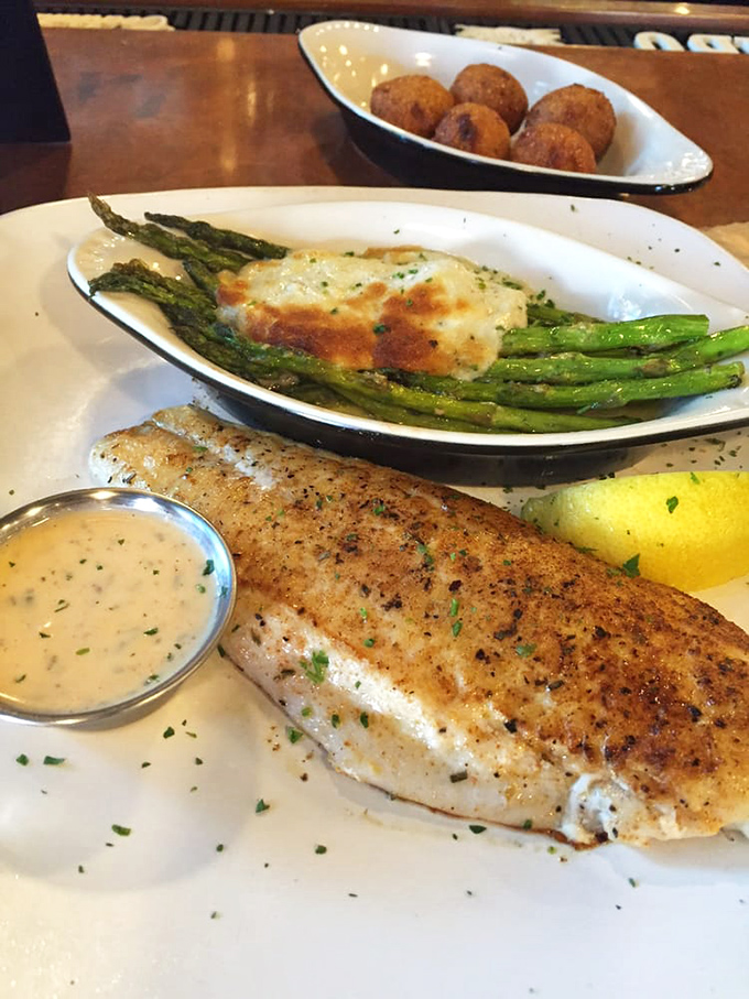 Fish so fresh, it might just swim off your plate! Paired with asparagus and a mystery sauce, it's a seafood lover's hat trick.