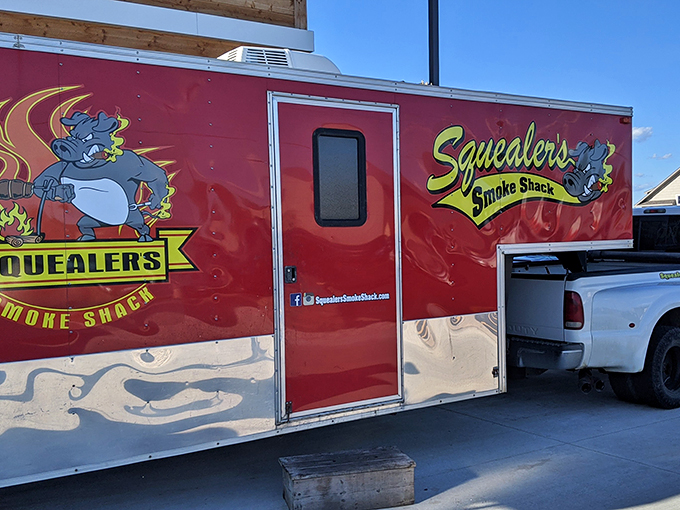 The mothership has landed! Squealer's food truck brings smoky joy to the masses, like a BBQ-powered DeLorean from a delicious future.