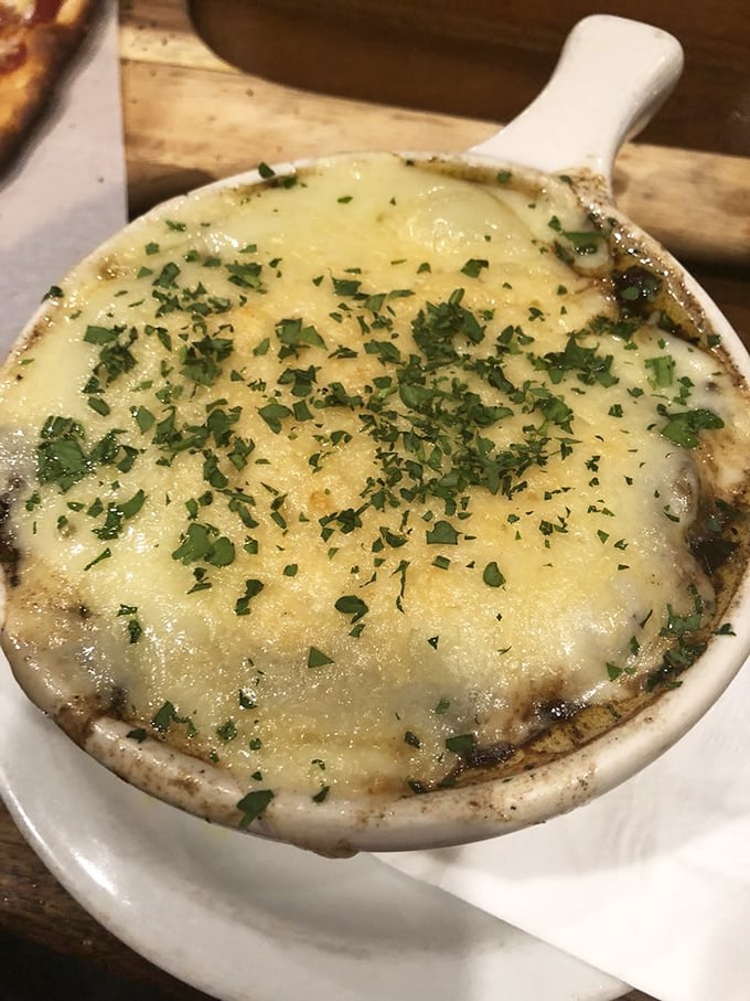 Dive into a bowl of French onion soup that's cheesier than a ukulele rendition of "Tiny Bubbles." Magnifique meets mahalo!