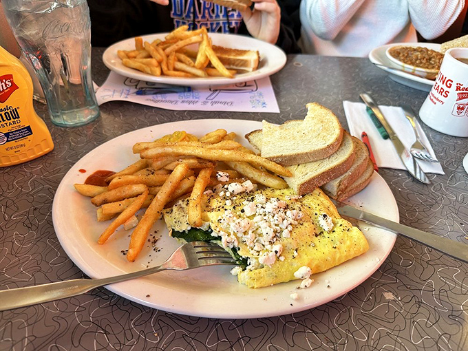 A Greek tragedy? Hardly! This omelet is an epic feast fit for the gods, with a supporting cast of crispy hash browns and toast.